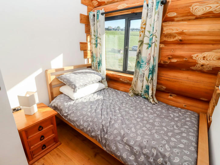 See the Inside of This Lakeside Cabin With a Huge Deck and Endless Meadows